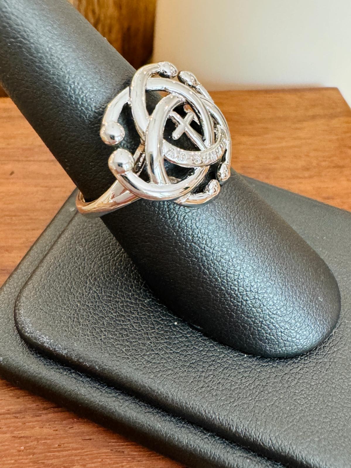 Antonella's Intertwining Perseverance Ring With Cross